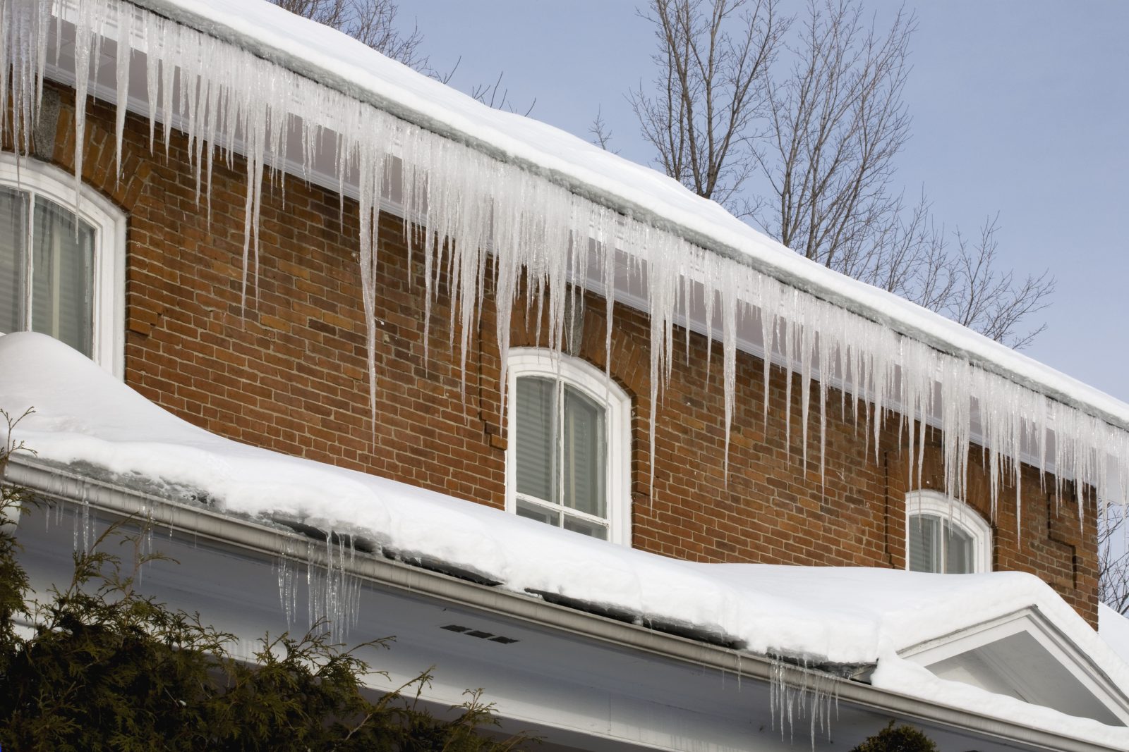 Most Common Dangers of Frozen Gutters - Muth and Company Roofing